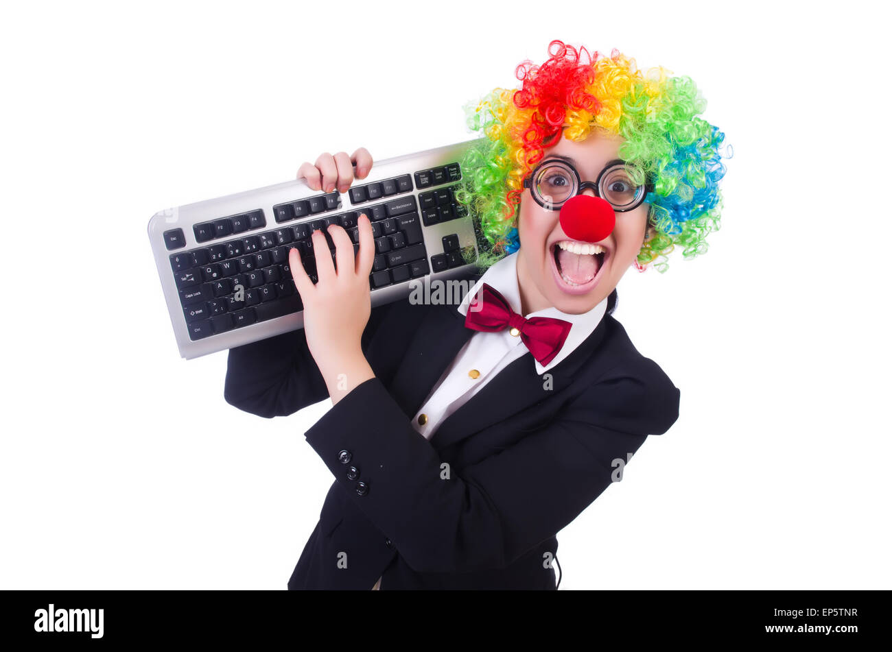 Funny clown with keyboard on white Stock Photo - Alamy