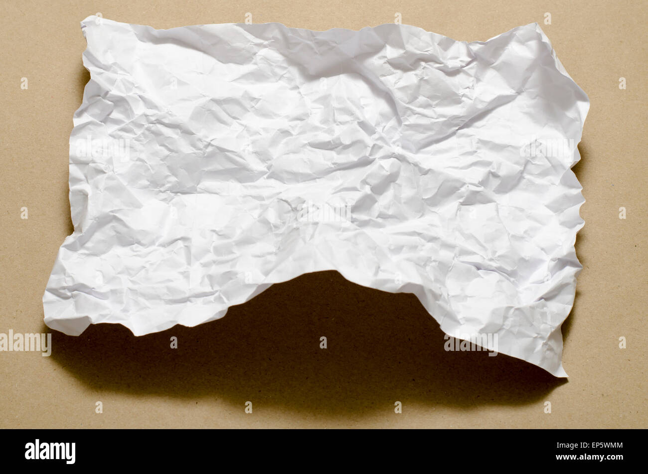 a4 size white crumpled paper on brown color background Stock Photo - Alamy
