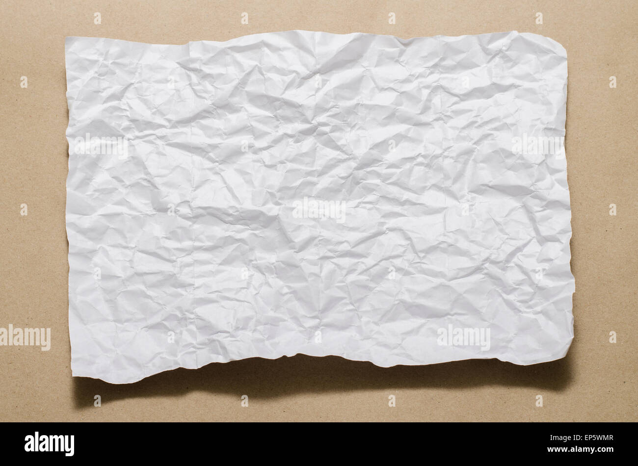 a4 size white crumpled paper on brown color background Stock Photo - Alamy