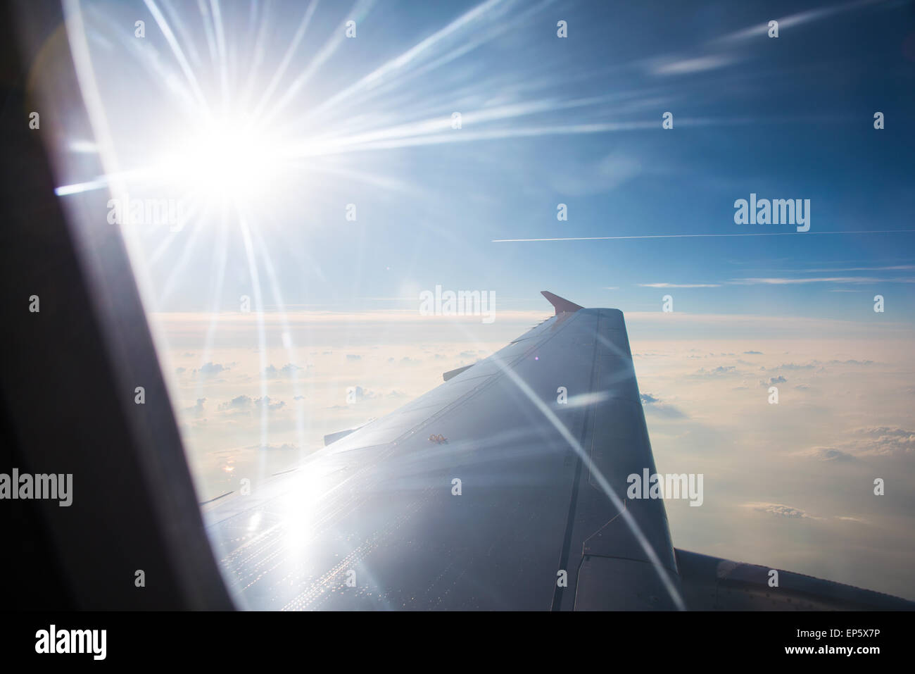 Airplane wing out of window Stock Photo - Alamy