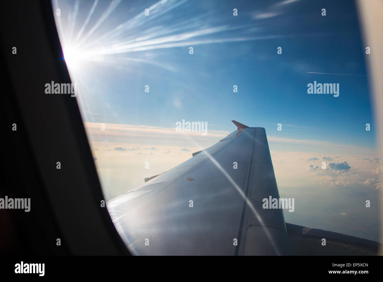 Airplane wing out of window Stock Photo - Alamy