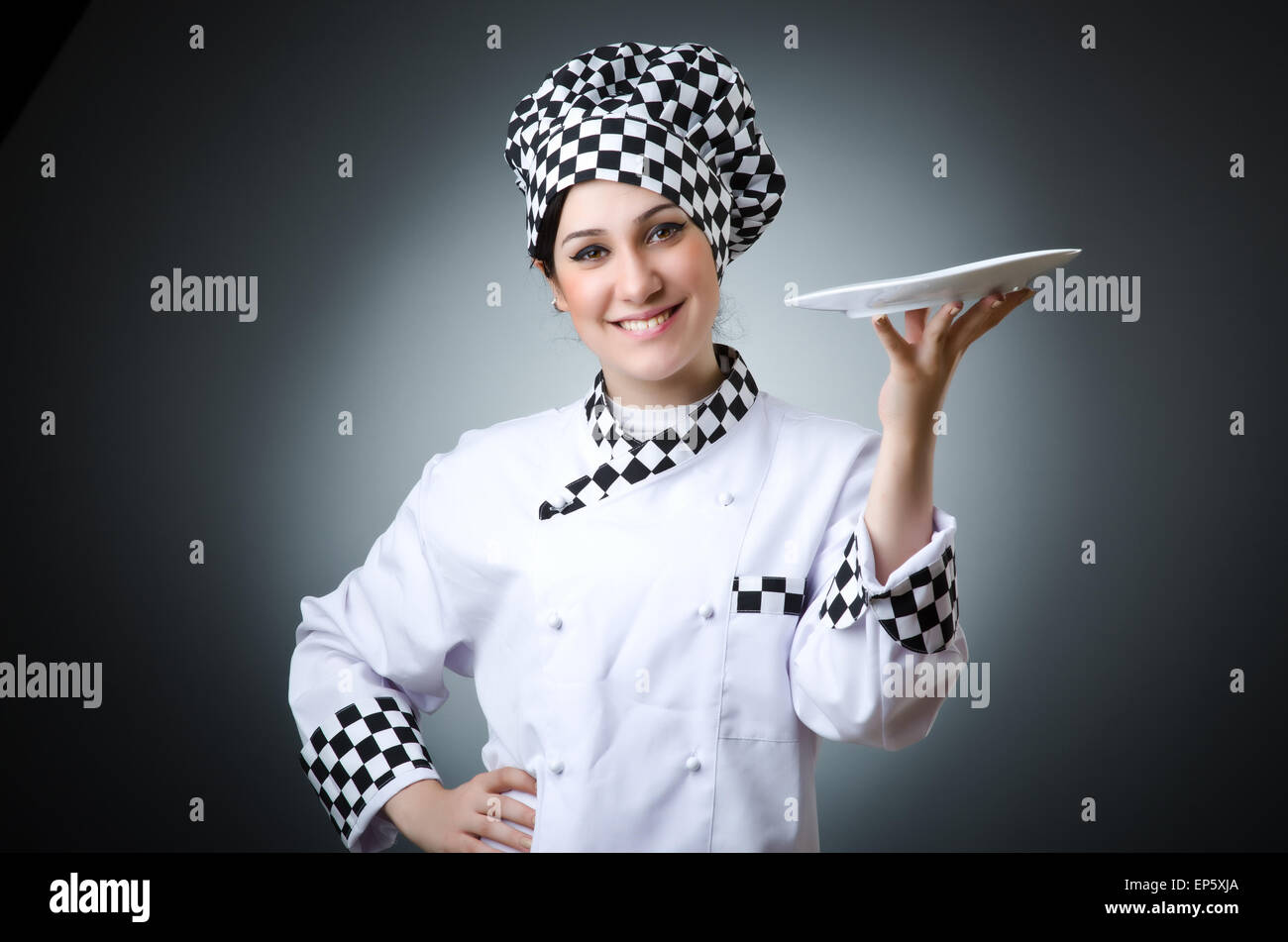 Pretty cook with kitchen utensils Stock Photo - Alamy