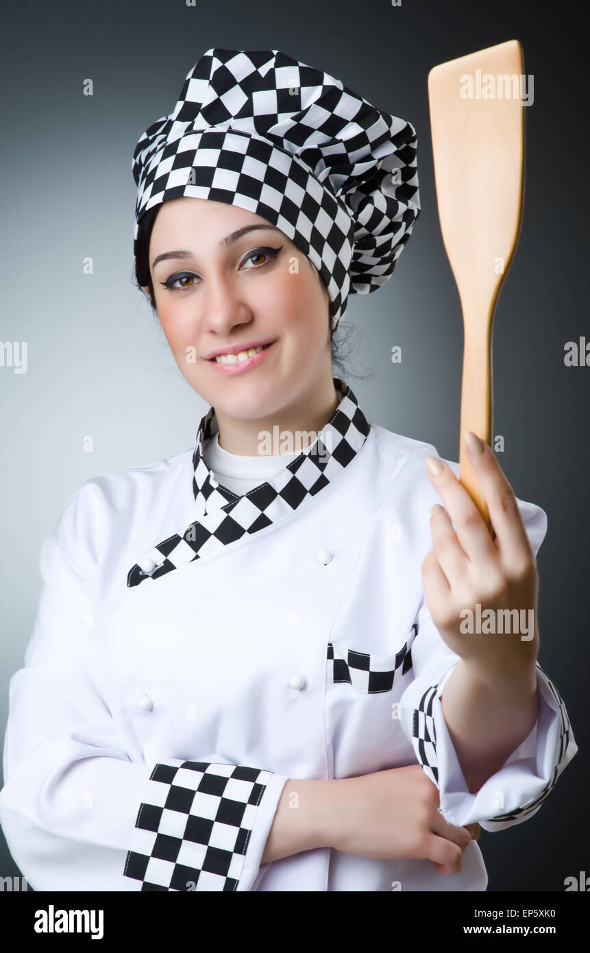Pretty cook with kitchen utensils Stock Photo - Alamy