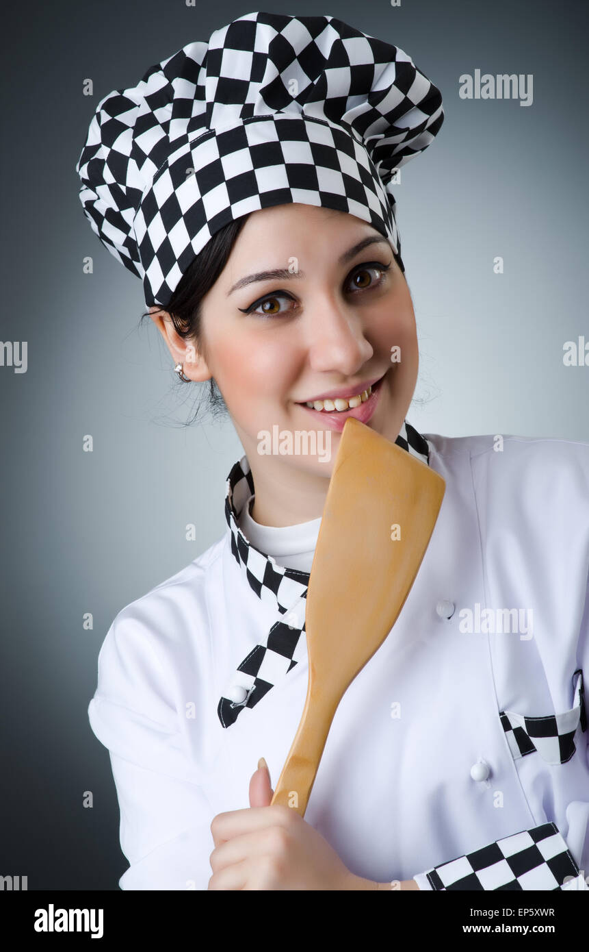Pretty cook with kitchen utensils Stock Photo - Alamy