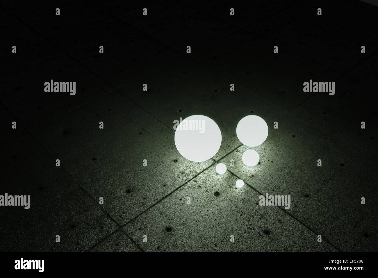 luminescent spheres glowing on concrete floor Stock Photo - Alamy