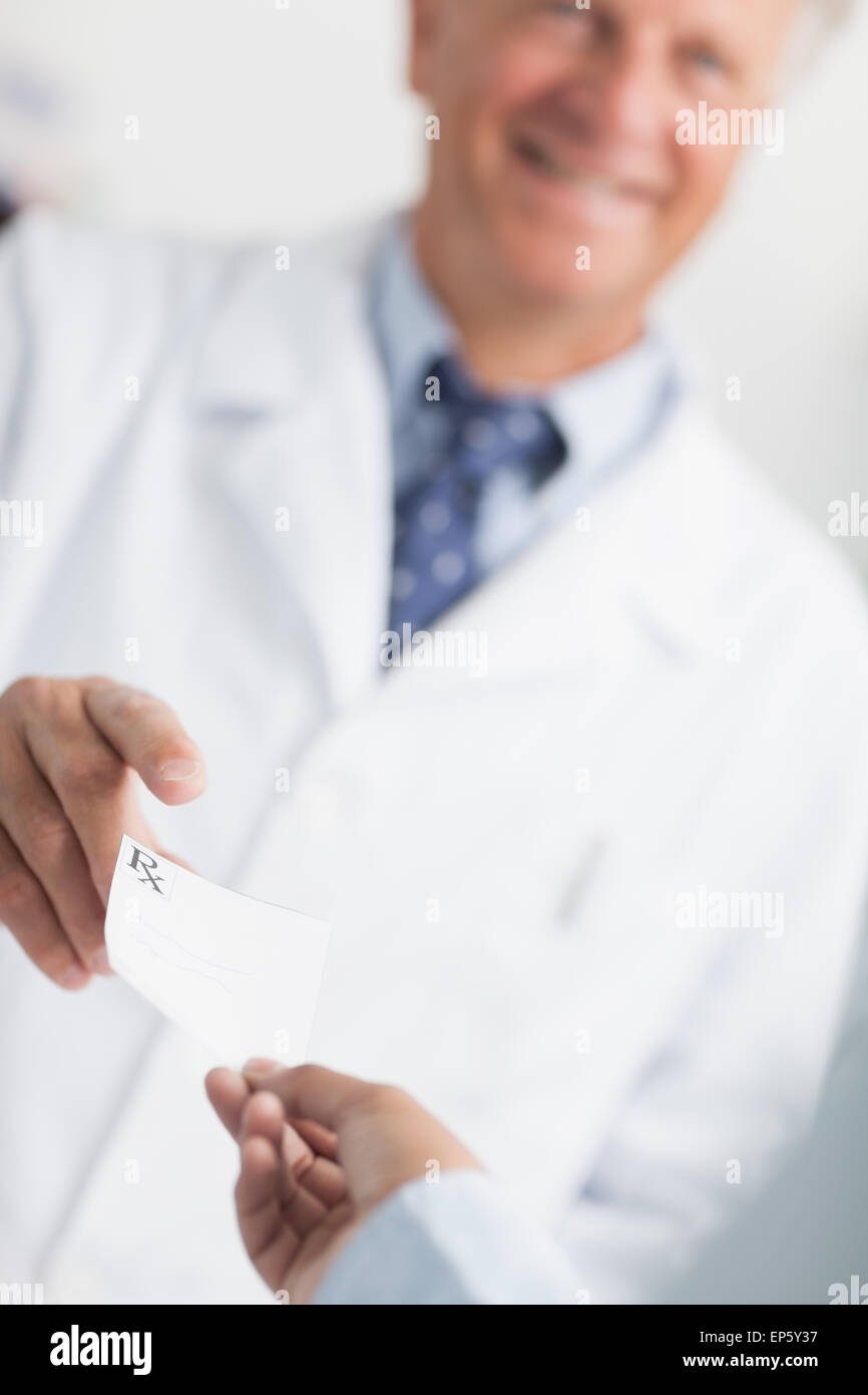 Customer handing a Rx prescription to a pharmacist Stock Photo - Alamy