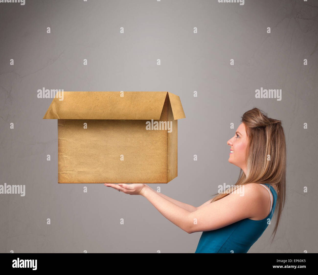 Young woman holding an empty cardboard box Stock Photo - Alamy