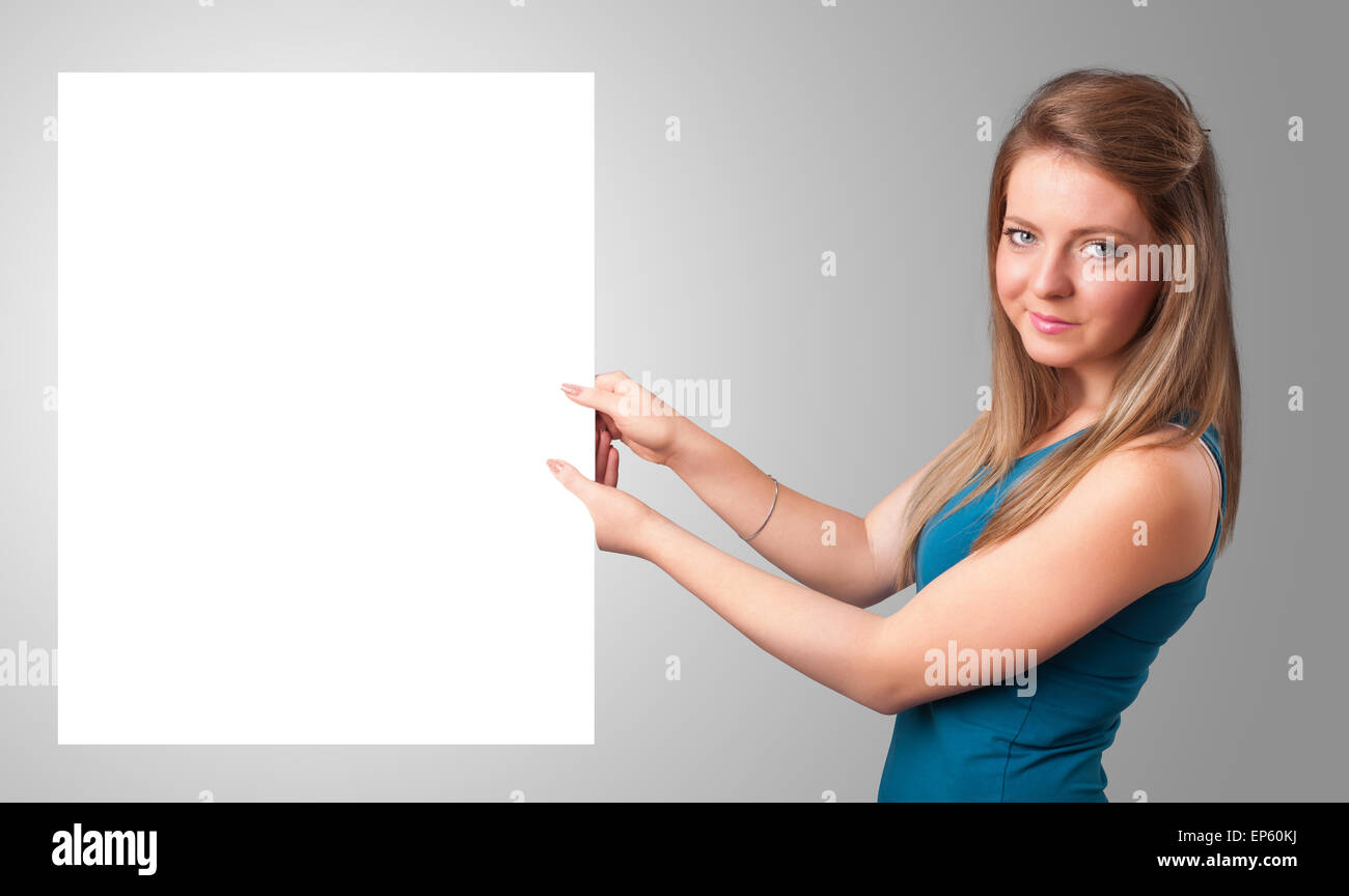 Young woman presenting white paper copy space Stock Photo - Alamy