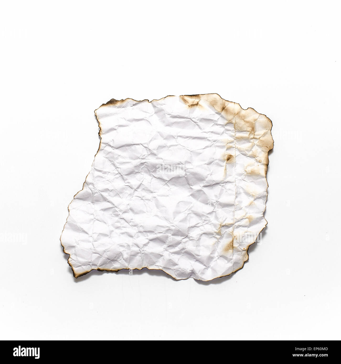 burn of crumpled paper on a white background Stock Photo - Alamy