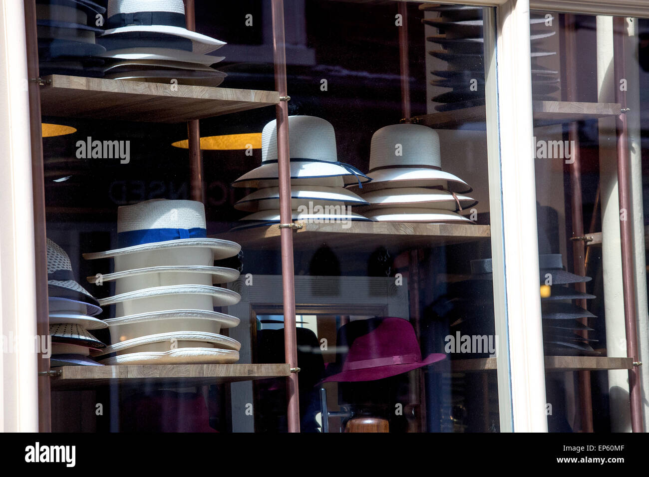 Hat shop stack panama hats for sale window Stock Photo - Alamy