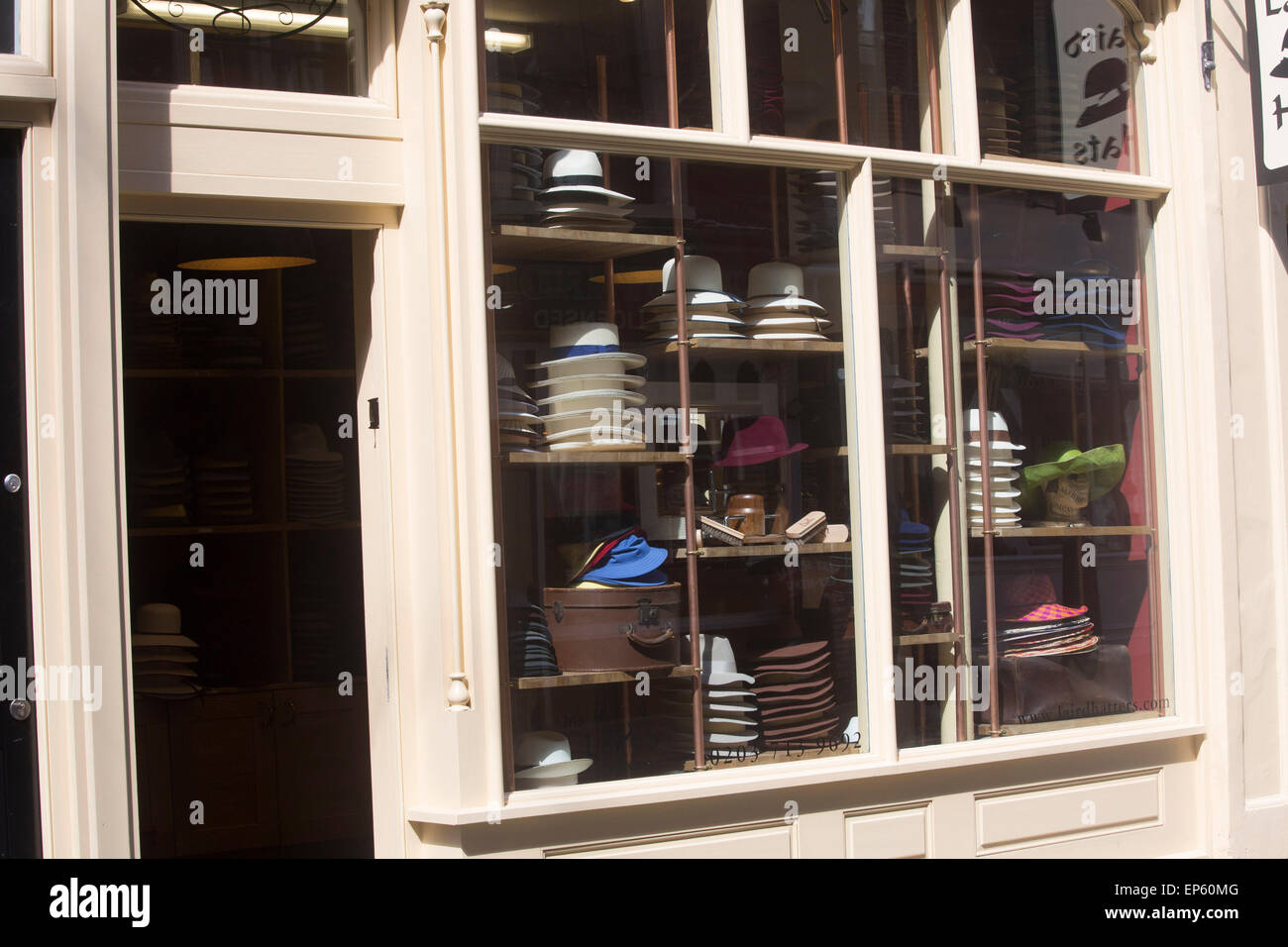 Hat shop stack panama hats for sale window Stock Photo - Alamy