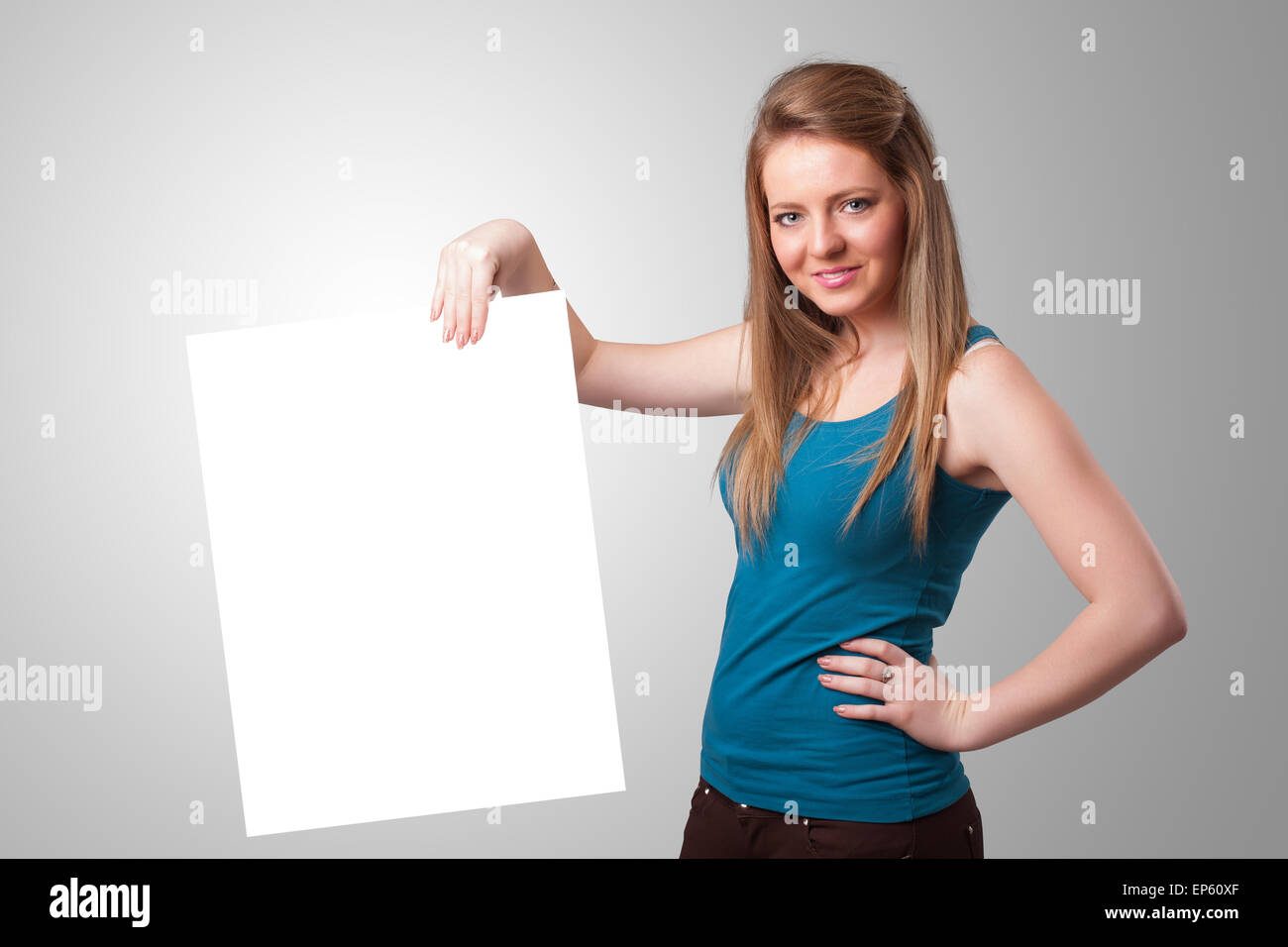 Young woman presenting white paper copy space Stock Photo - Alamy