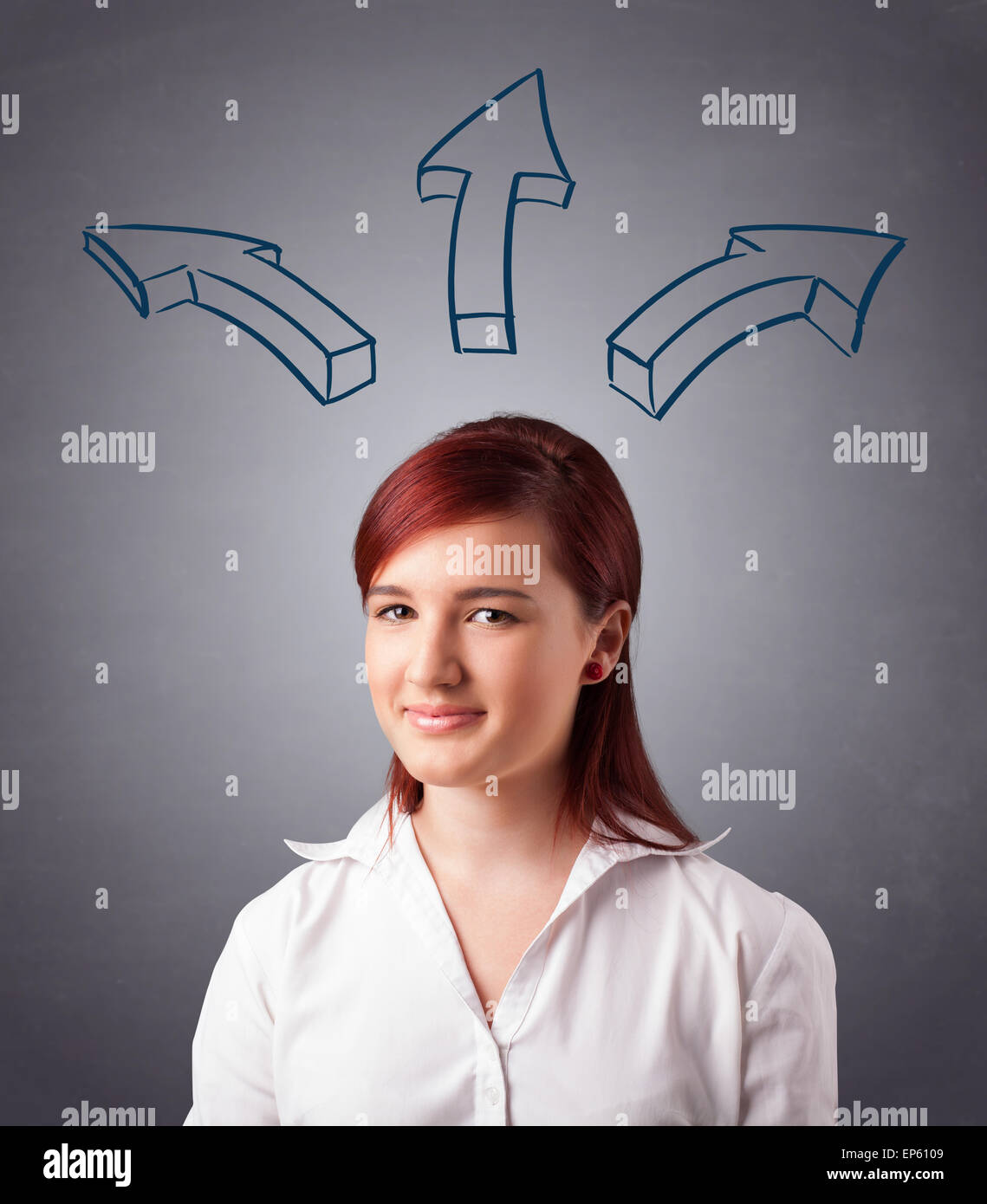 Pretty lady thinking with arrows overhead Stock Photo - Alamy