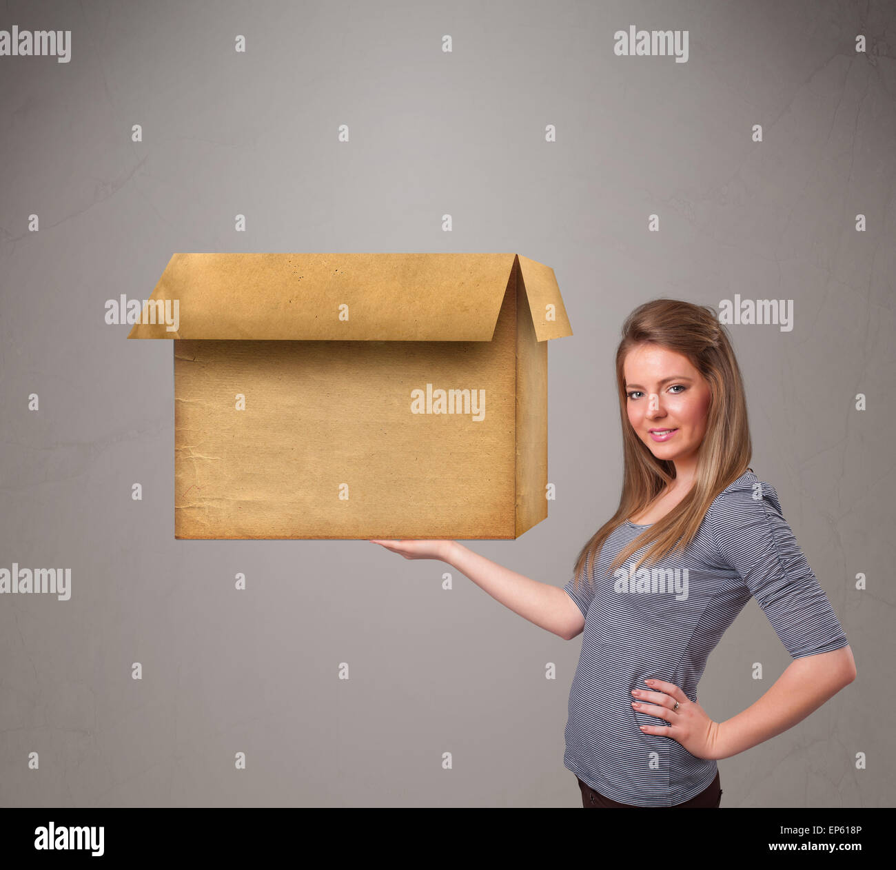Young woman holding an empty cardboard box Stock Photo - Alamy