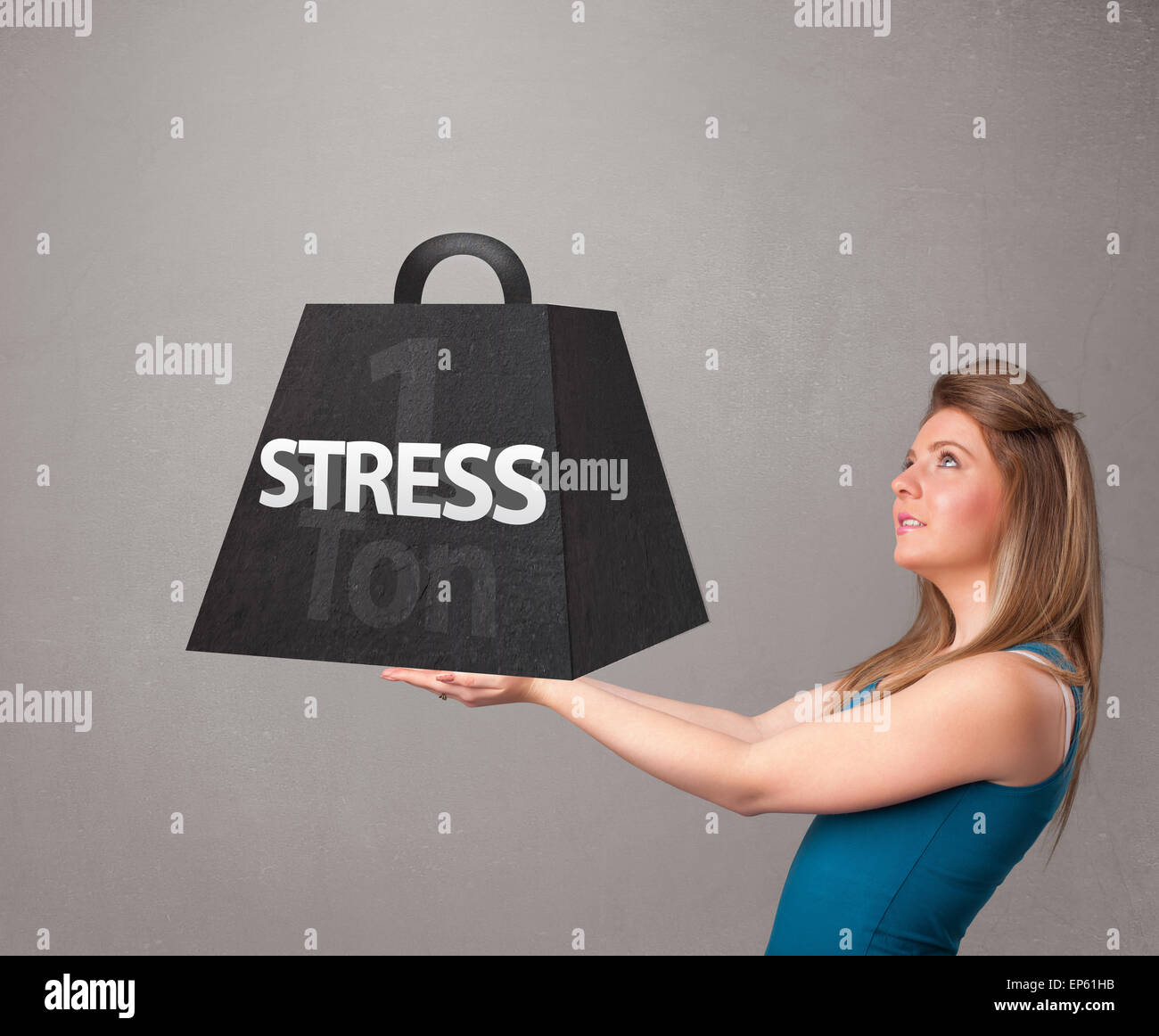 Young woman holding one ton of stress weight Stock Photo - Alamy