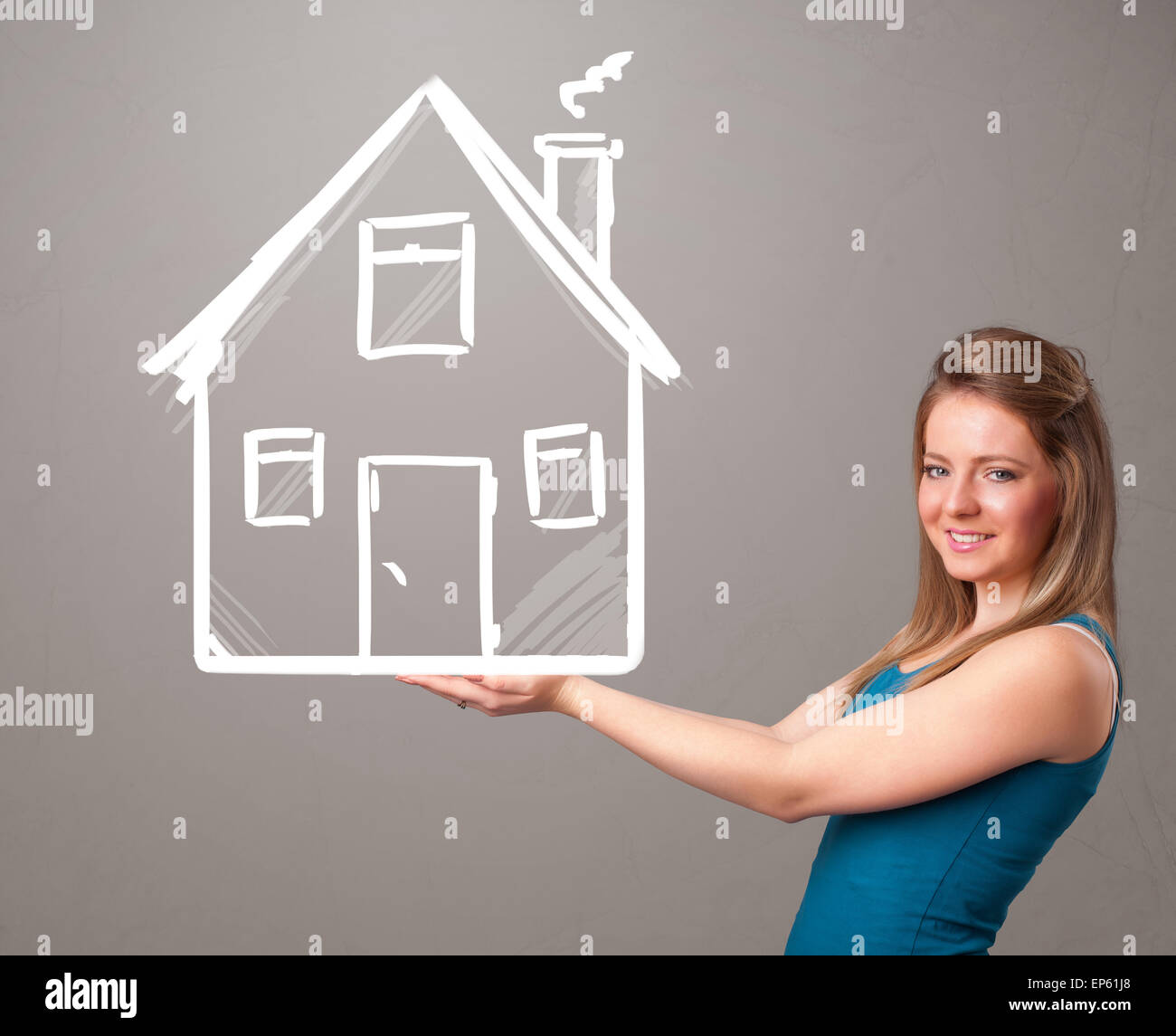Young lady holding a huge drawn house Stock Photo - Alamy