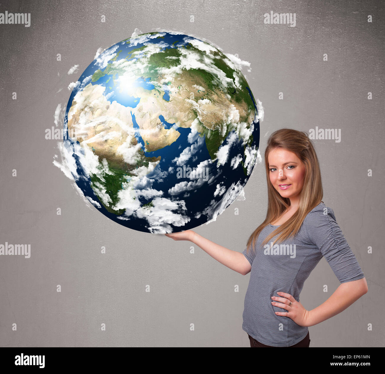 Pretty girl holding 3d planet earth Stock Photo - Alamy