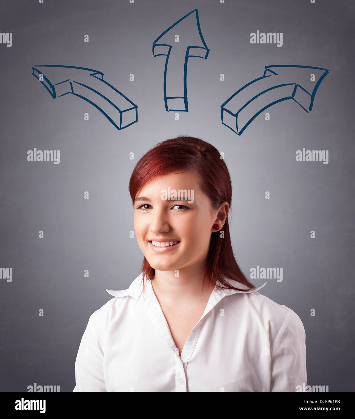 Pretty lady thinking with arrows overhead Stock Photo - Alamy