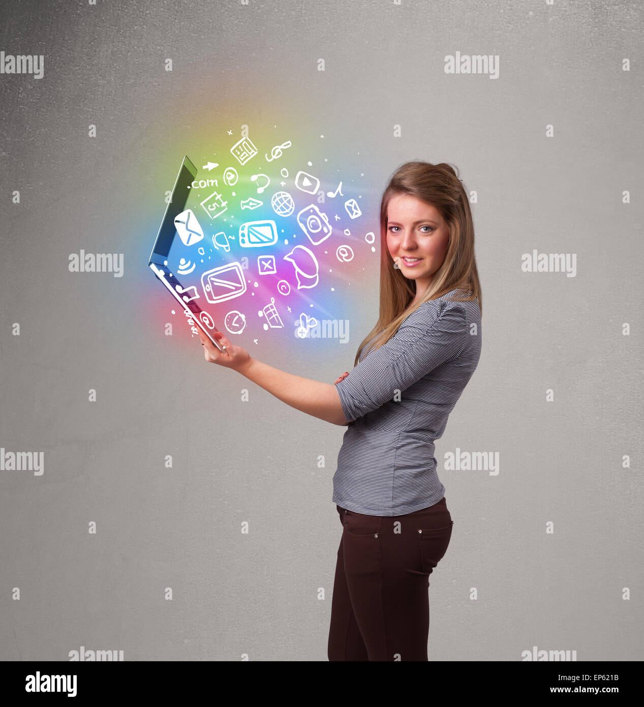 Young lady holding notebook with colorful hand drawn multimedia icons ...