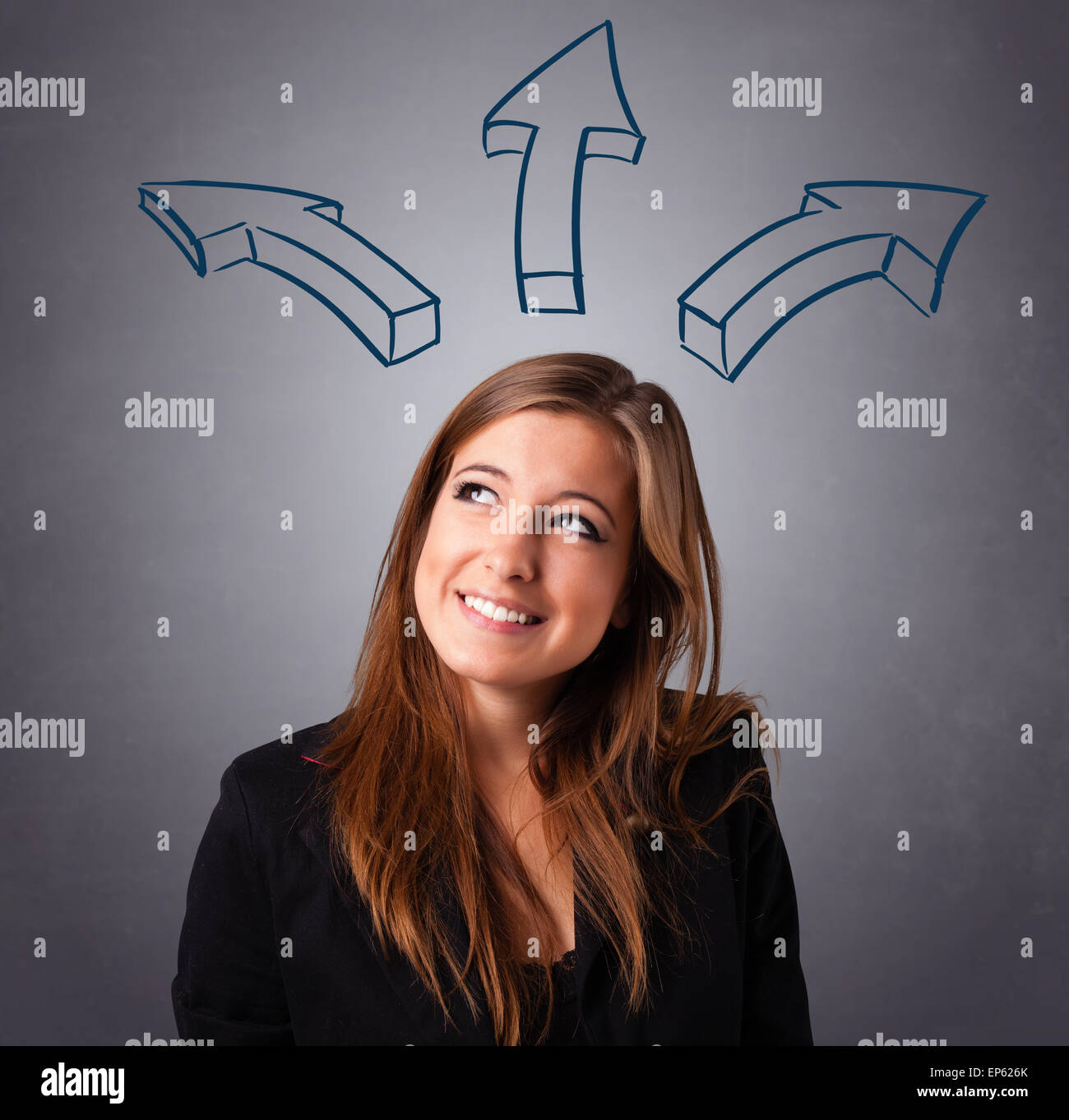 Pretty lady thinking with arrows overhead Stock Photo - Alamy