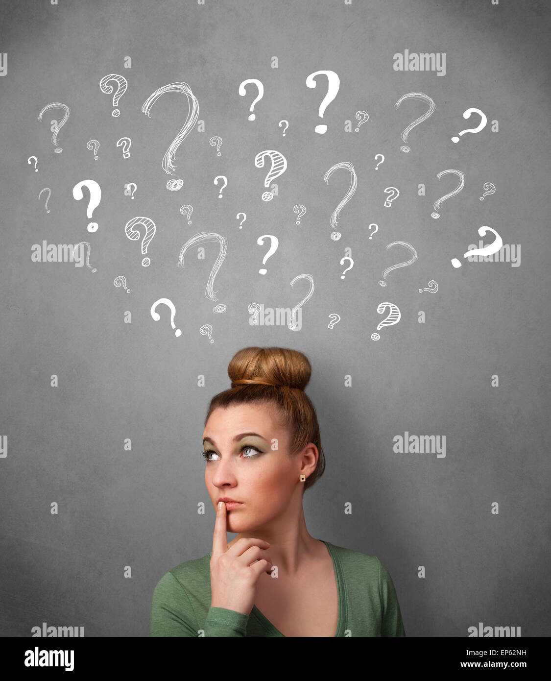 Young woman with question marks above her head Stock Photo - Alamy