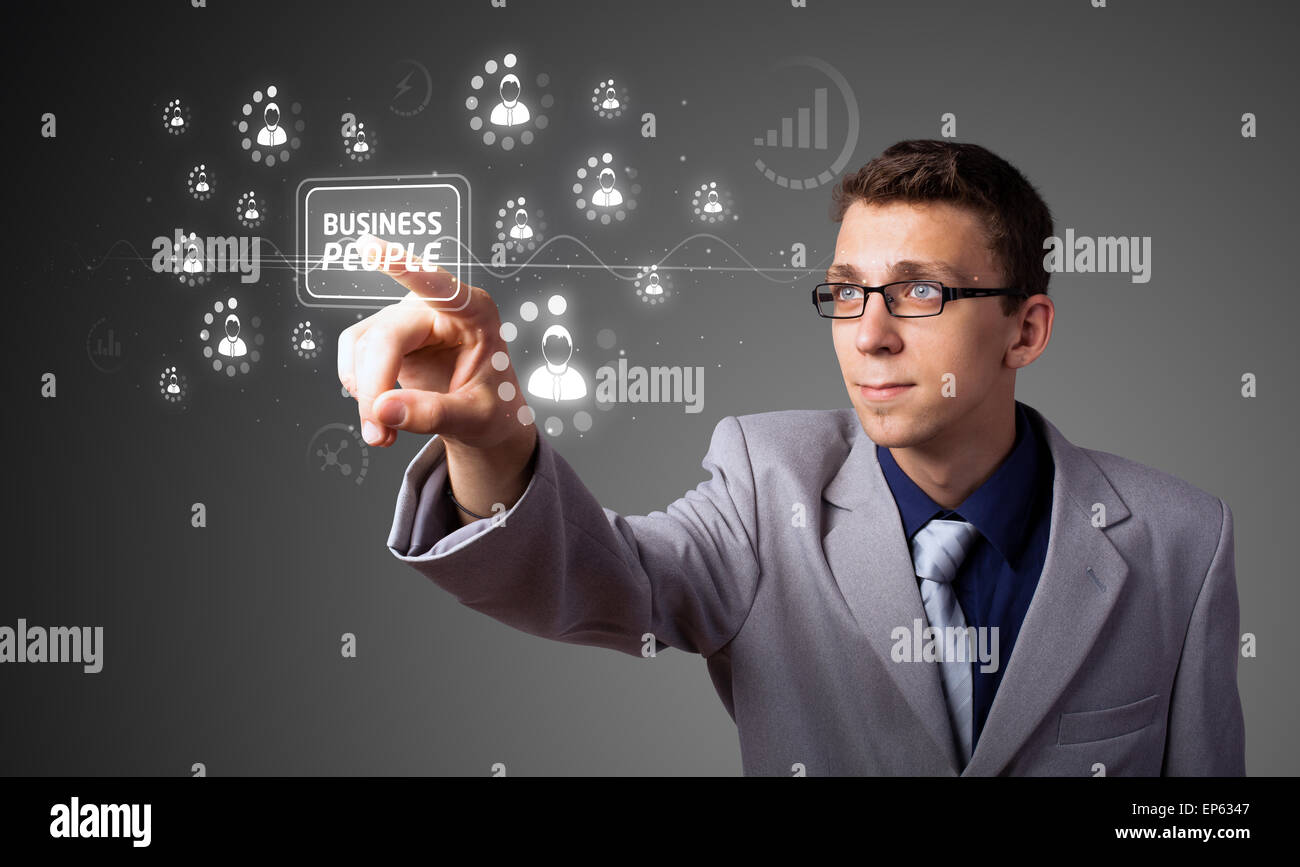 Businessman pressing modern business type of buttons Stock Photo - Alamy
