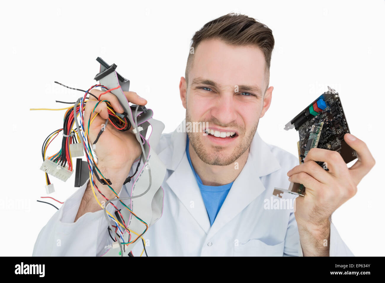 Portrait of young it professional yelling with cpu parts in hands Stock ...