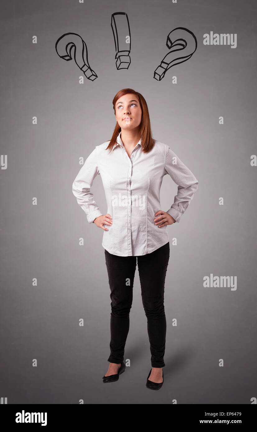Young lady thinking with question marks overhead Stock Photo - Alamy