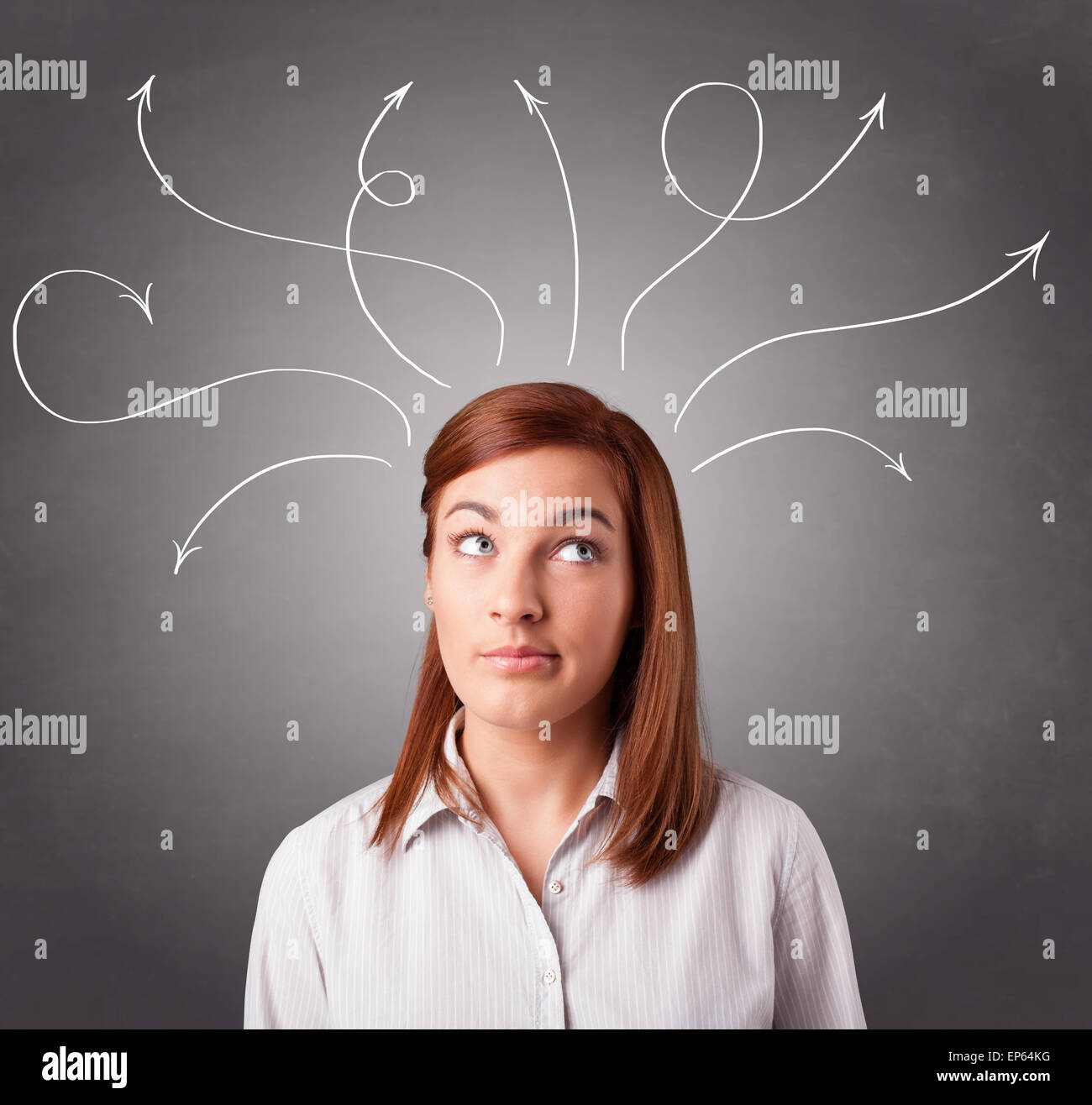Young girl thinking with arrows overhead Stock Photo - Alamy
