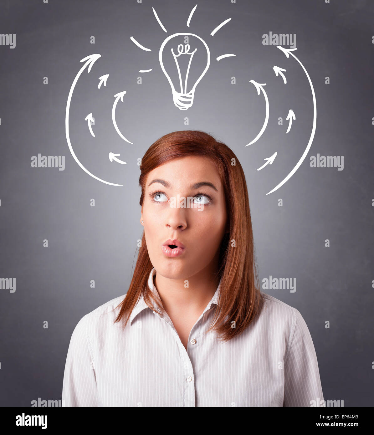 Pretty lady thinking with arrows and light bulb overhead Stock Photo ...