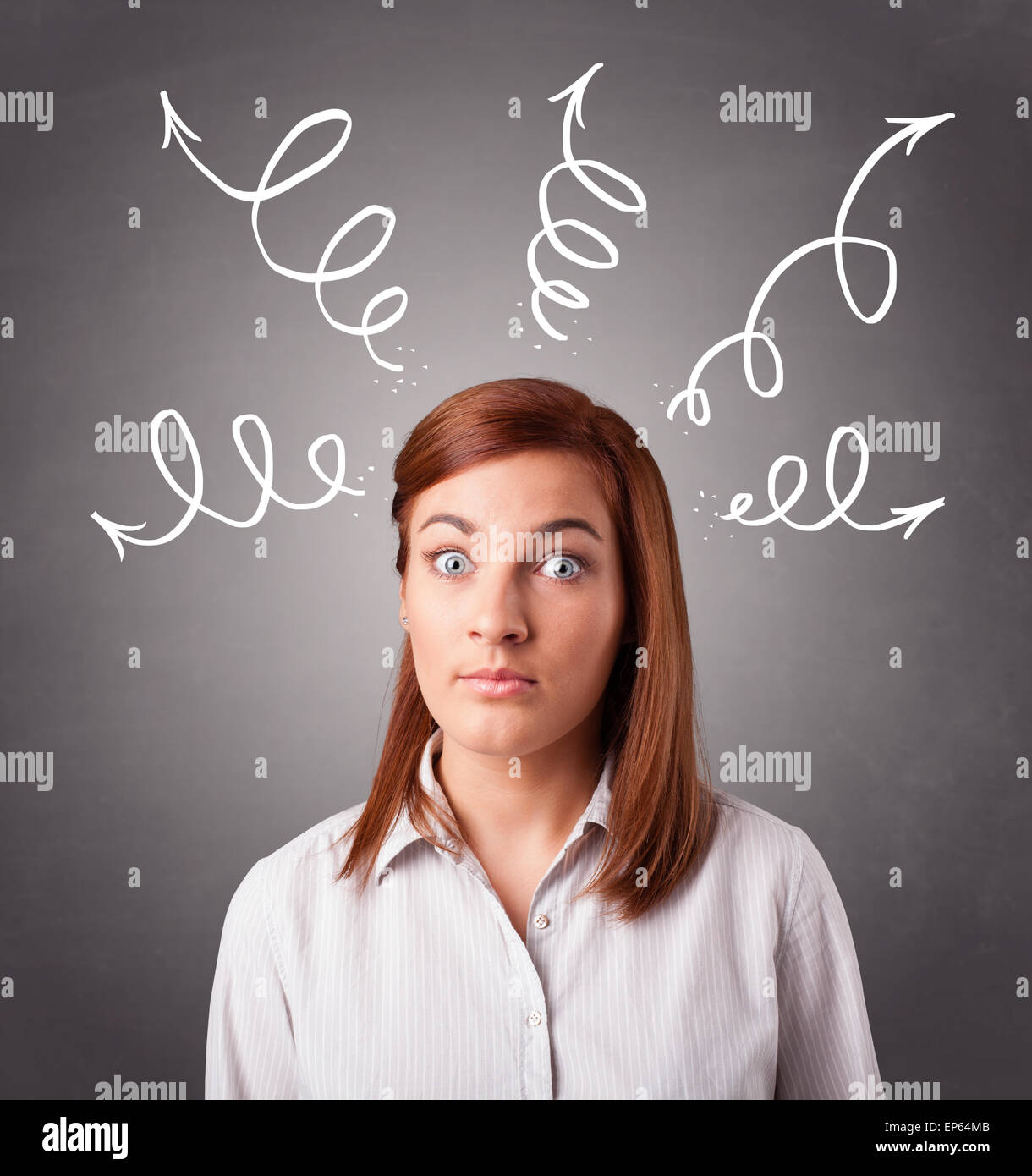 Young woman thinking with arrows overhead Stock Photo - Alamy