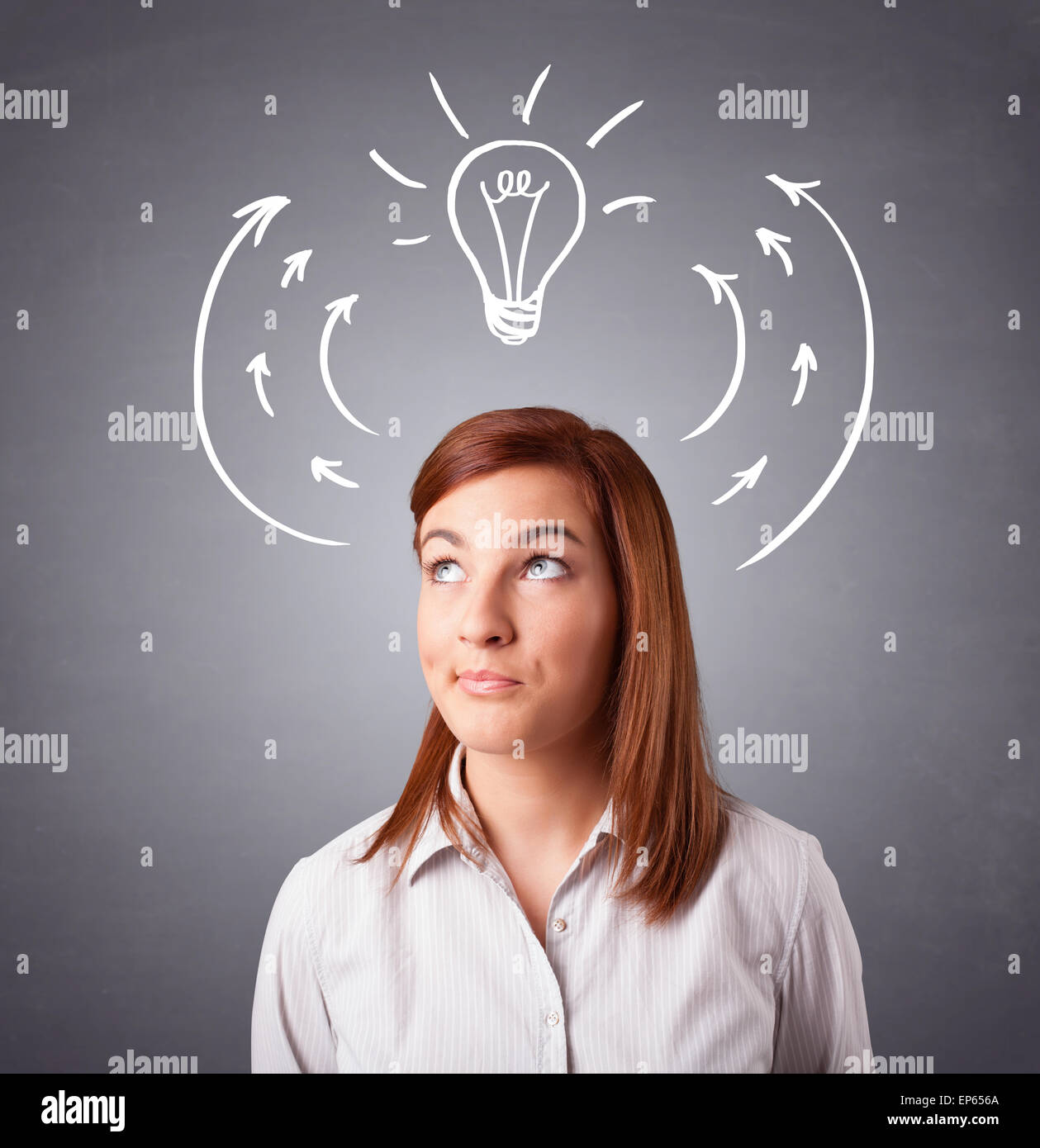 Pretty lady thinking with arrows and light bulb overhead Stock Photo ...