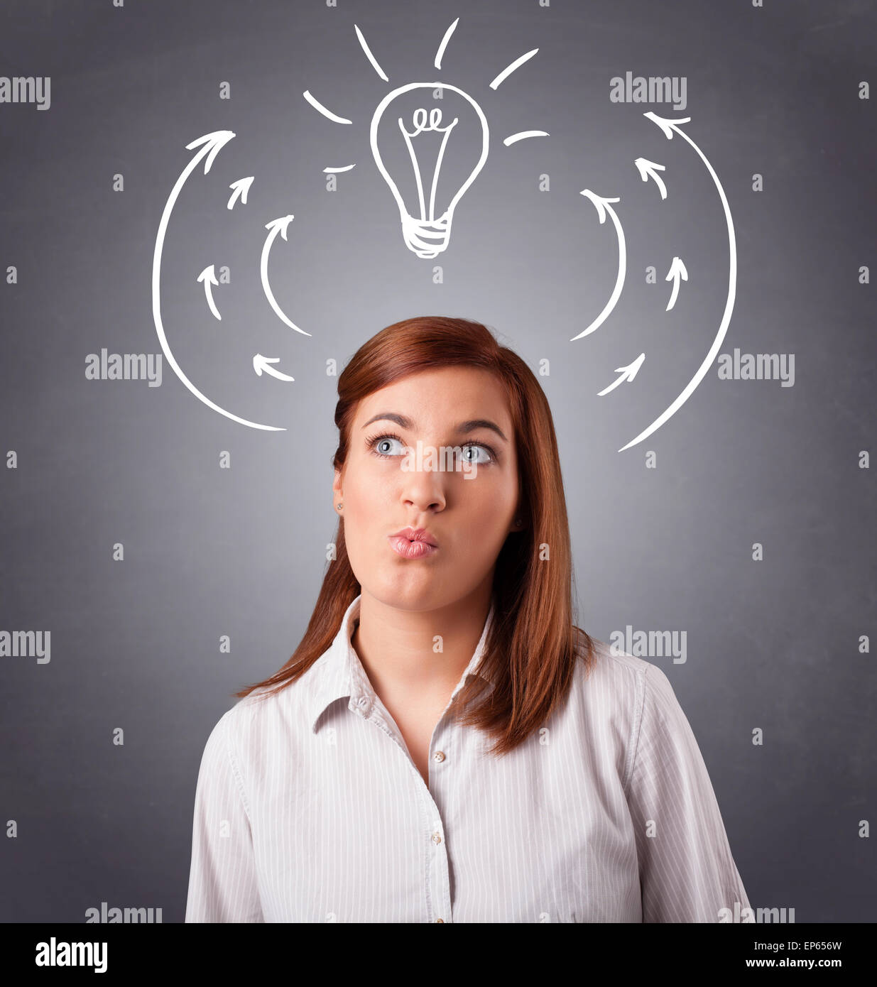Pretty lady thinking with arrows and light bulb overhead Stock Photo ...