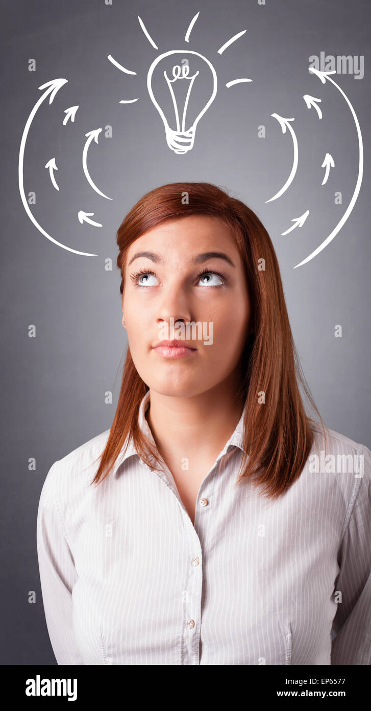 Pretty lady thinking with arrows and light bulb overhead Stock Photo ...