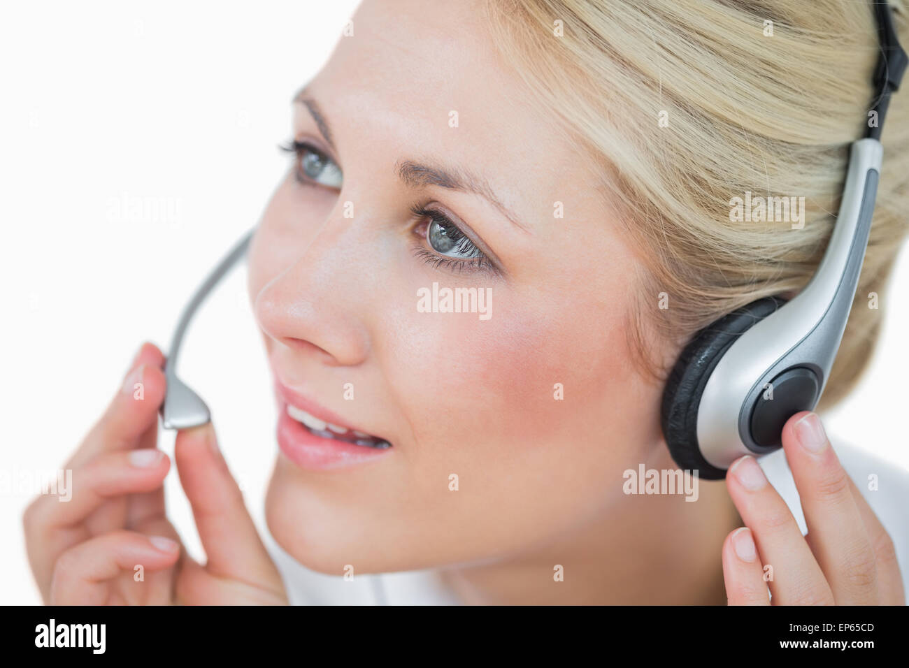 Closeup of young female executive wearing headset Stock Photo - Alamy