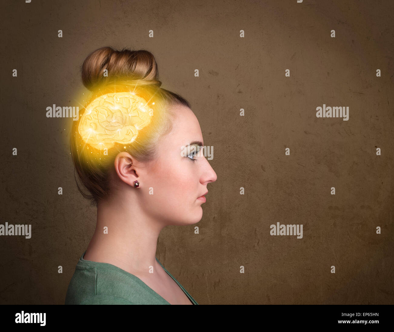 Young girl thinking with glowing brain illustration Stock Photo - Alamy