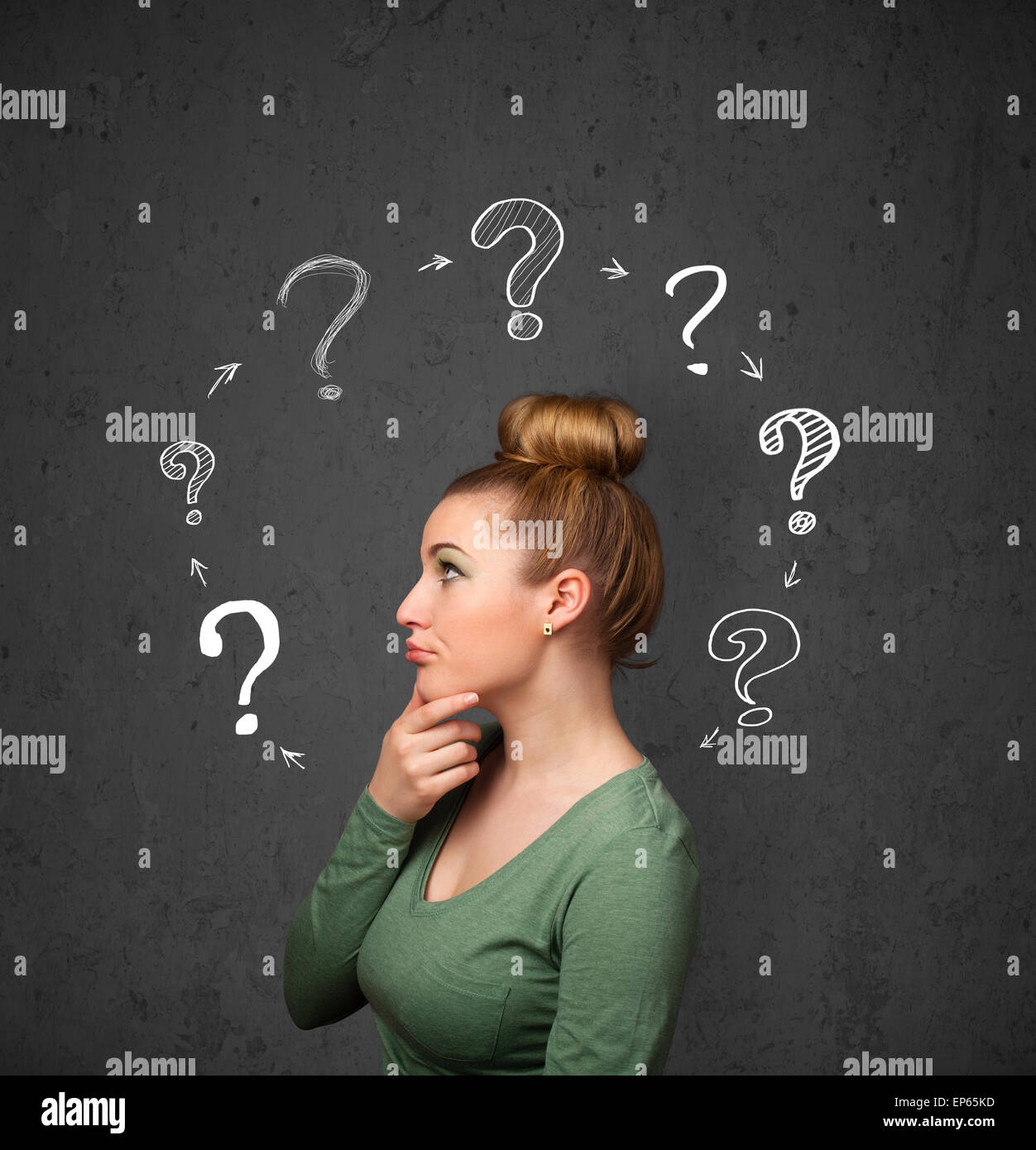 Young woman thinking with question mark circulation around her head ...
