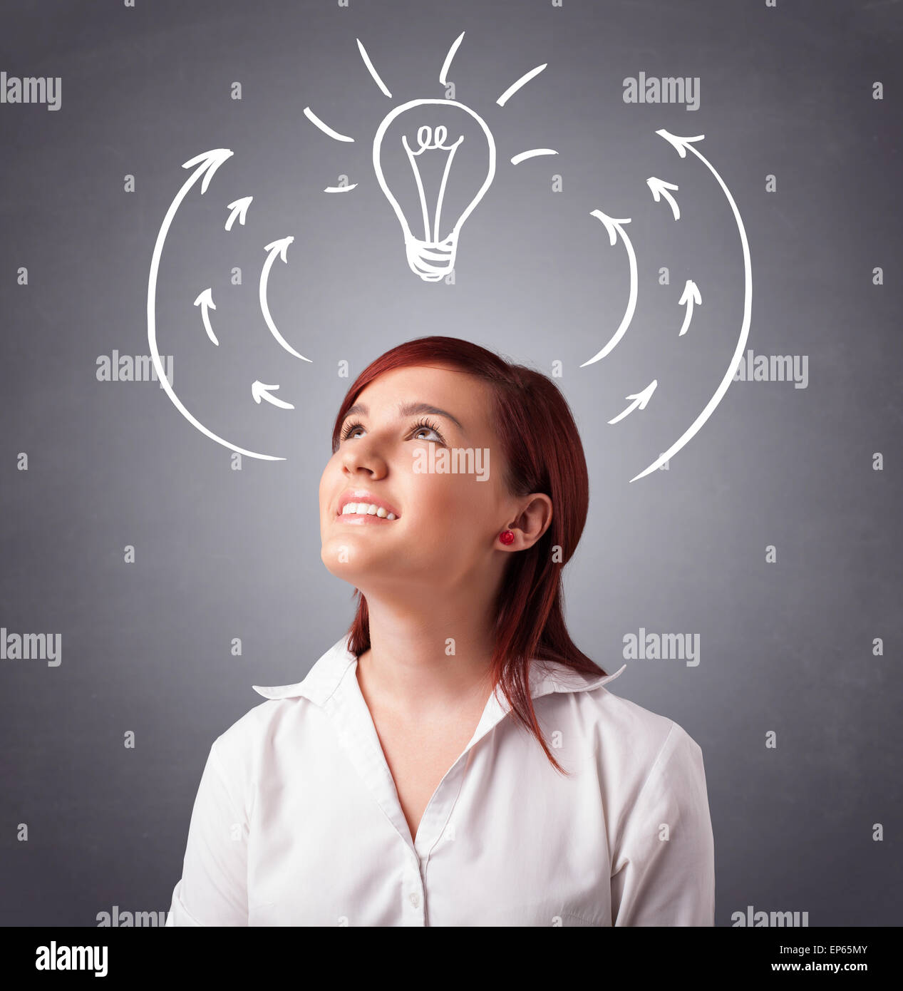 Pretty lady thinking with arrows and light bulb overhead Stock Photo ...