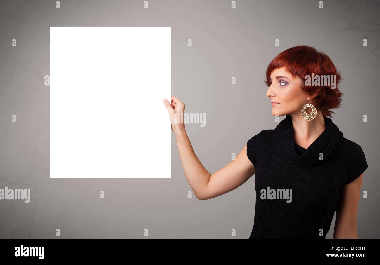 Young woman presenting white paper copy space Stock Photo - Alamy
