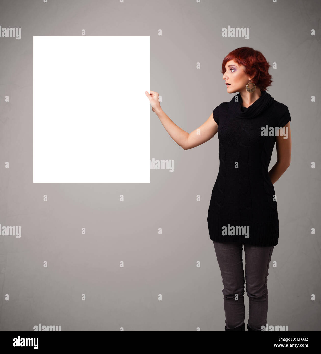 Young woman presenting white paper copy space Stock Photo - Alamy