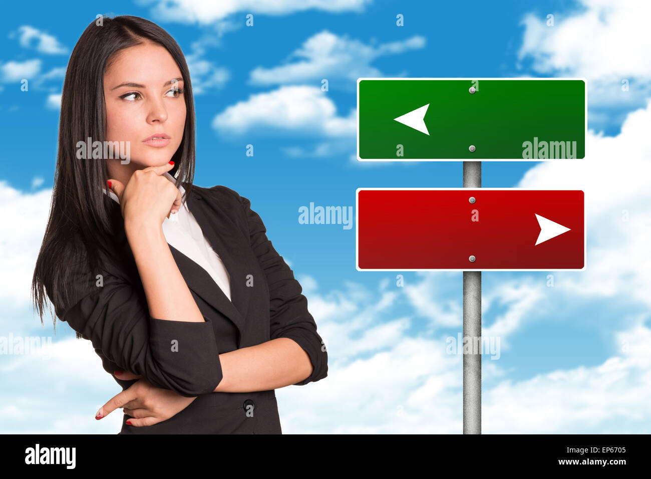 Thoughtful businesswoman looking to right side Stock Photo - Alamy