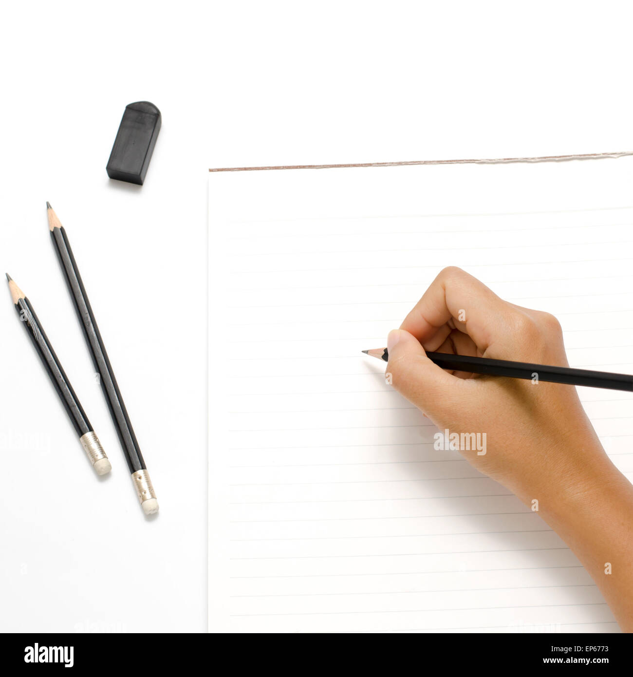 asia woman right hand writing with black pencil on paper over white ...