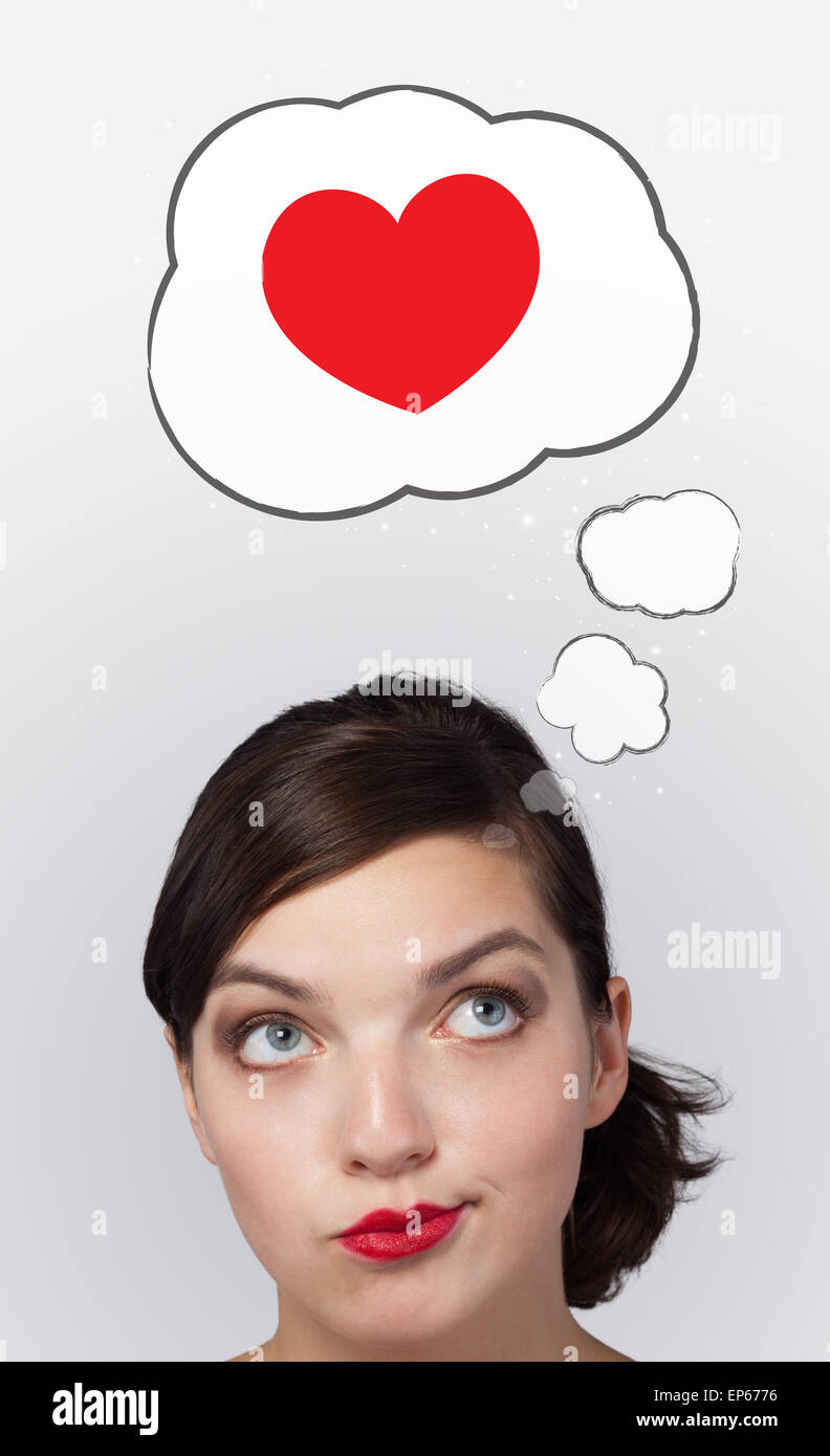 Young girl looking at love type of icons Stock Photo - Alamy