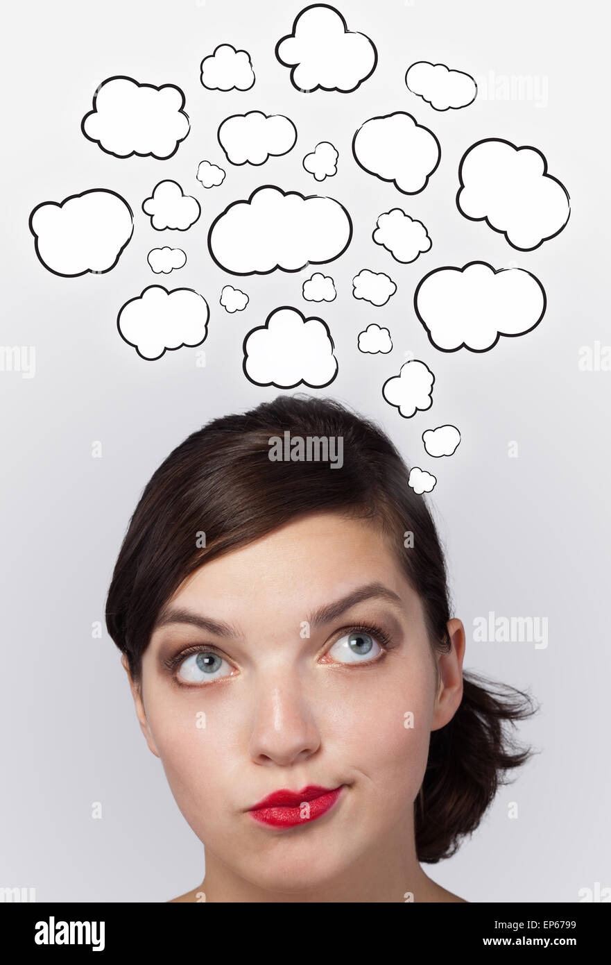 Young girl thinking with clouds Stock Photo - Alamy