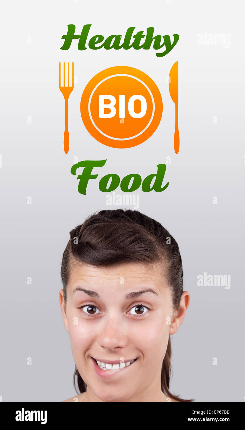 Young girl looking at healthy food sign Stock Photo - Alamy