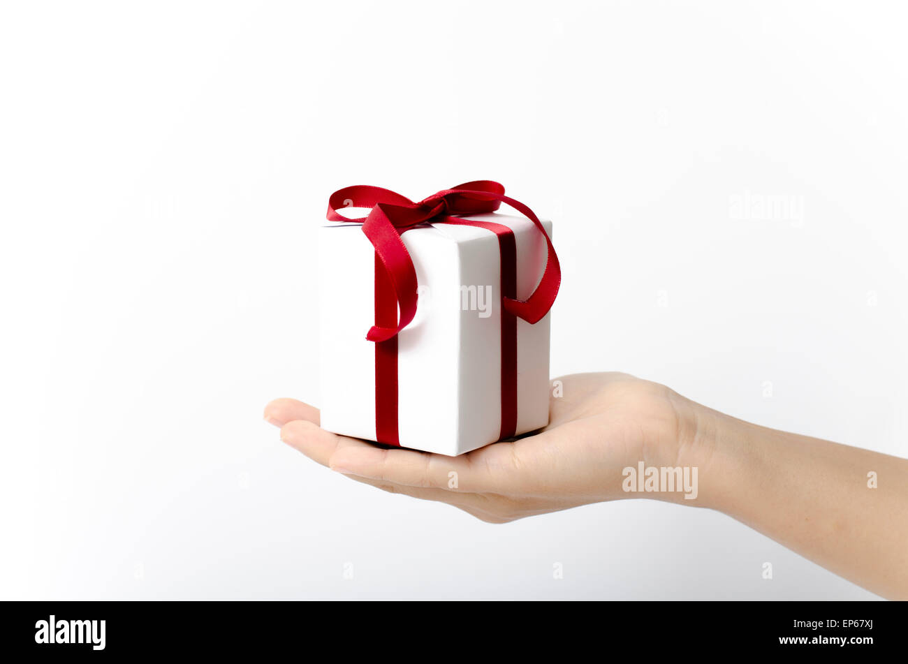 asia woman hand holding gift box on a white background Stock Photo - Alamy
