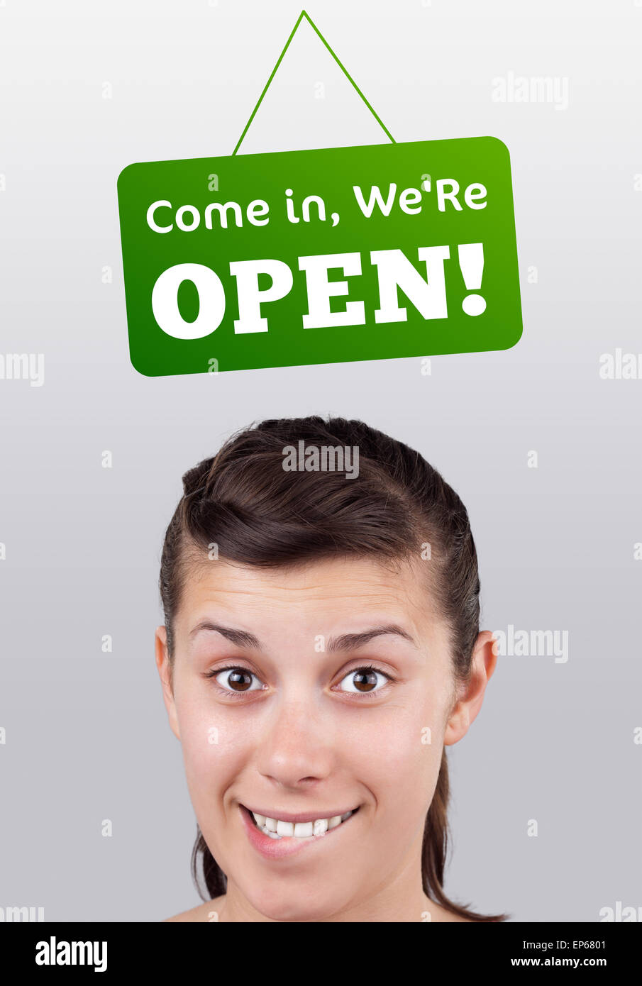 Young girl head looking at closed and open signs Stock Photo - Alamy