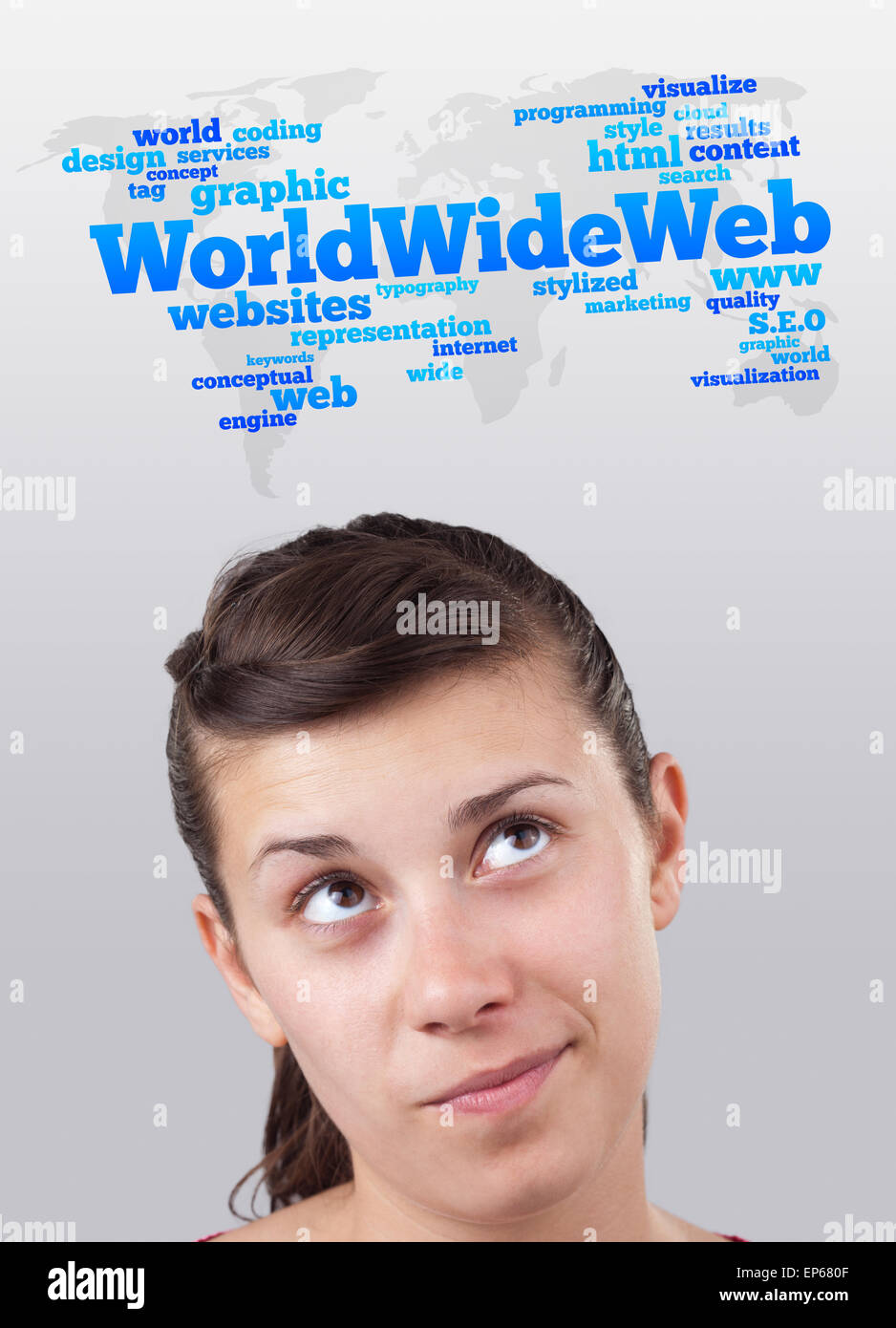 Young girl looking at internet type of icons Stock Photo - Alamy