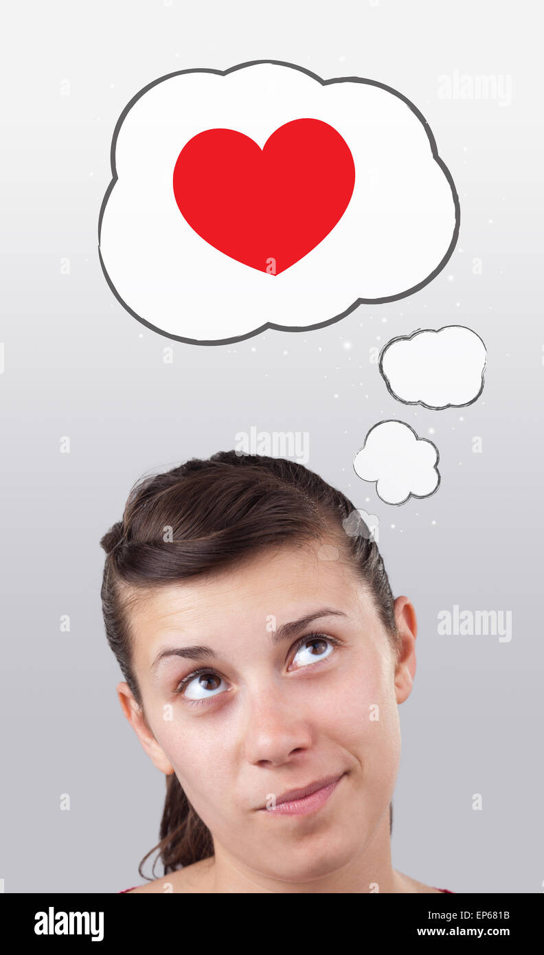 Young girl looking at love type of icons Stock Photo - Alamy