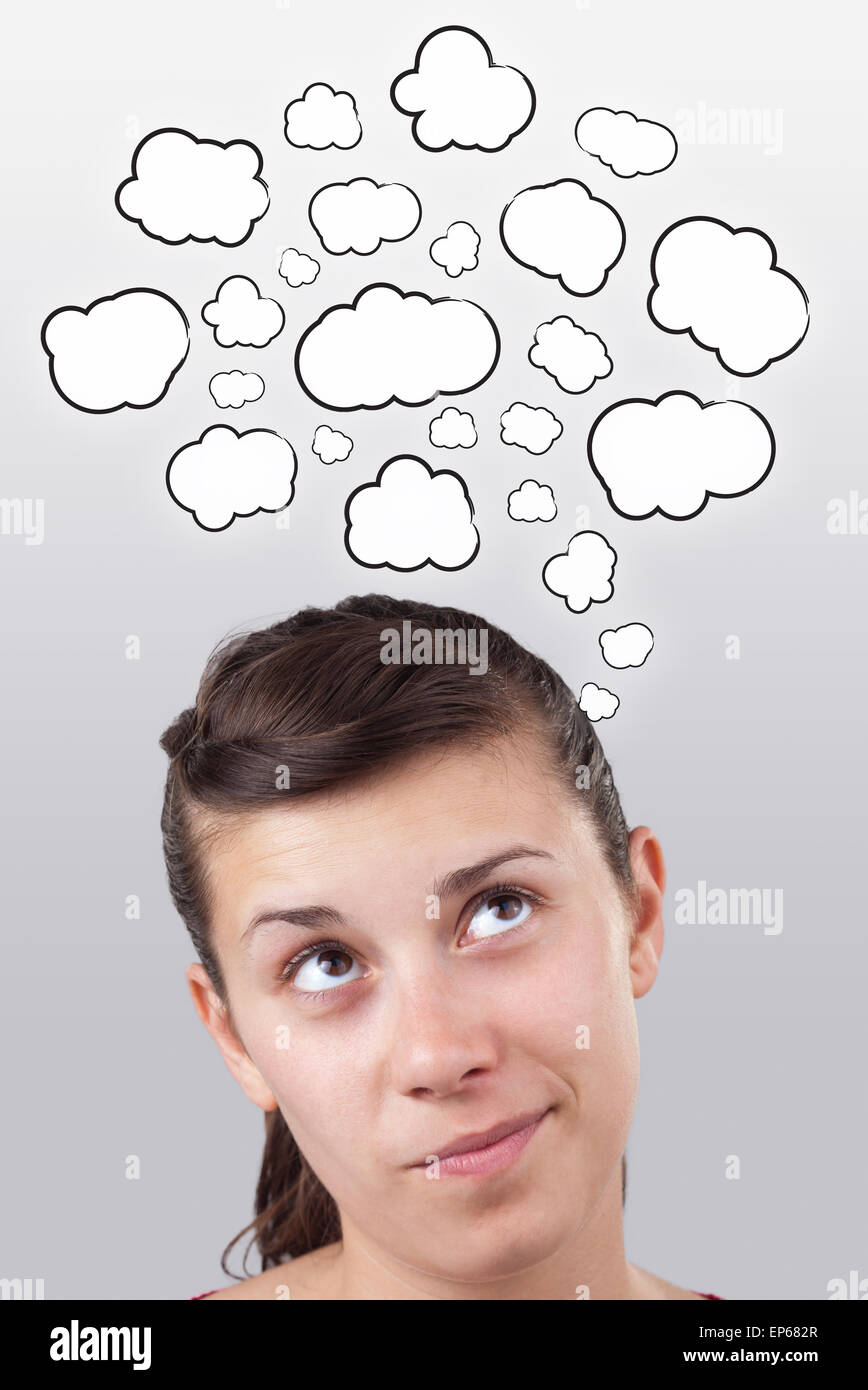 Young girl thinking with clouds Stock Photo - Alamy